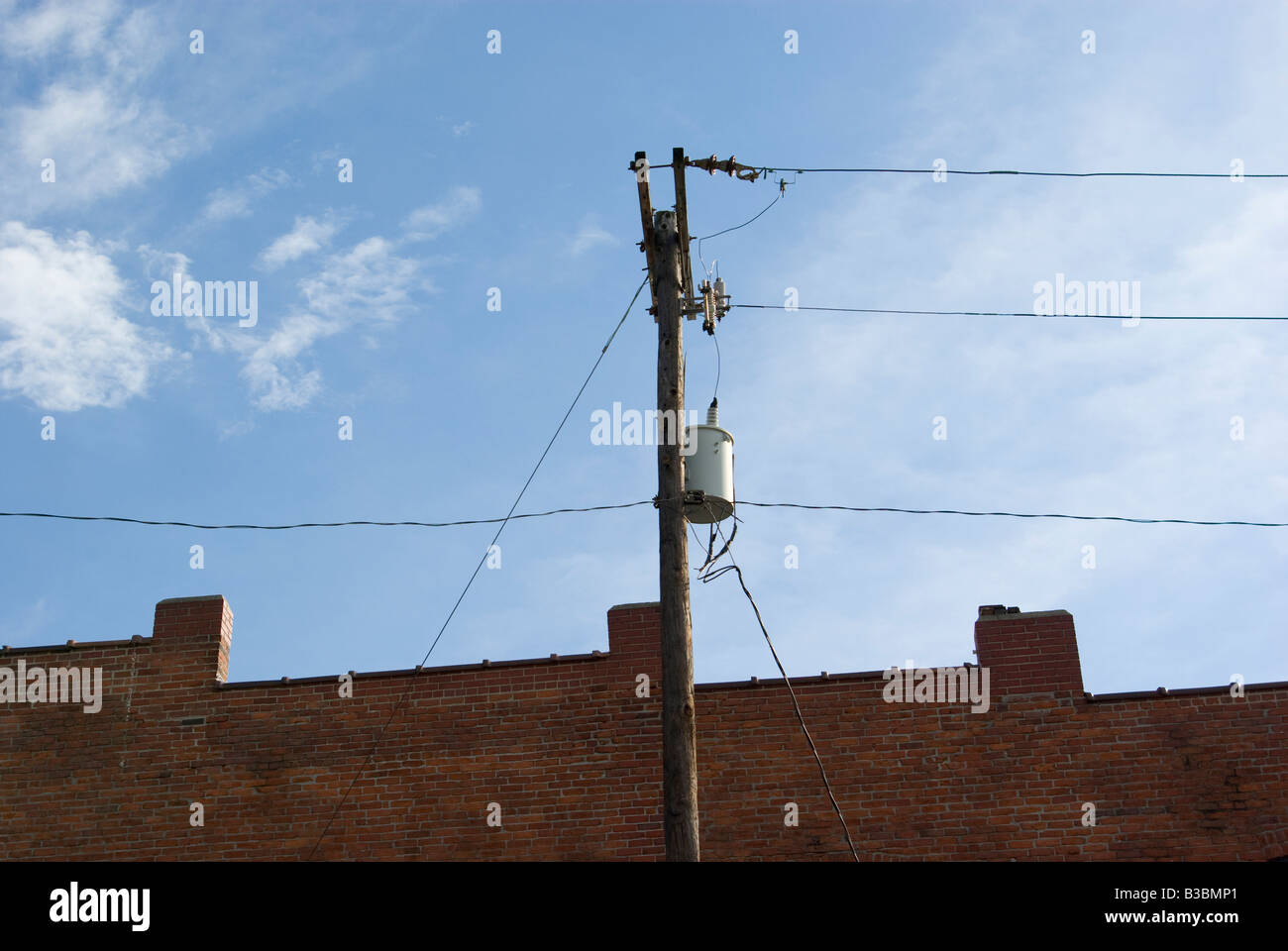 Brick turrets line the top of this factory building Stock Photo - Alamy