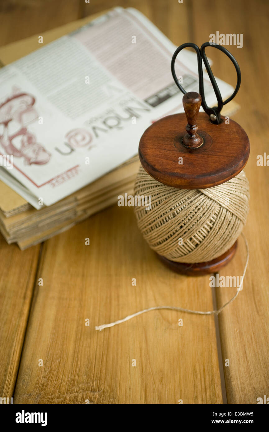 Newspaper and string hi-res stock photography and images - Alamy
