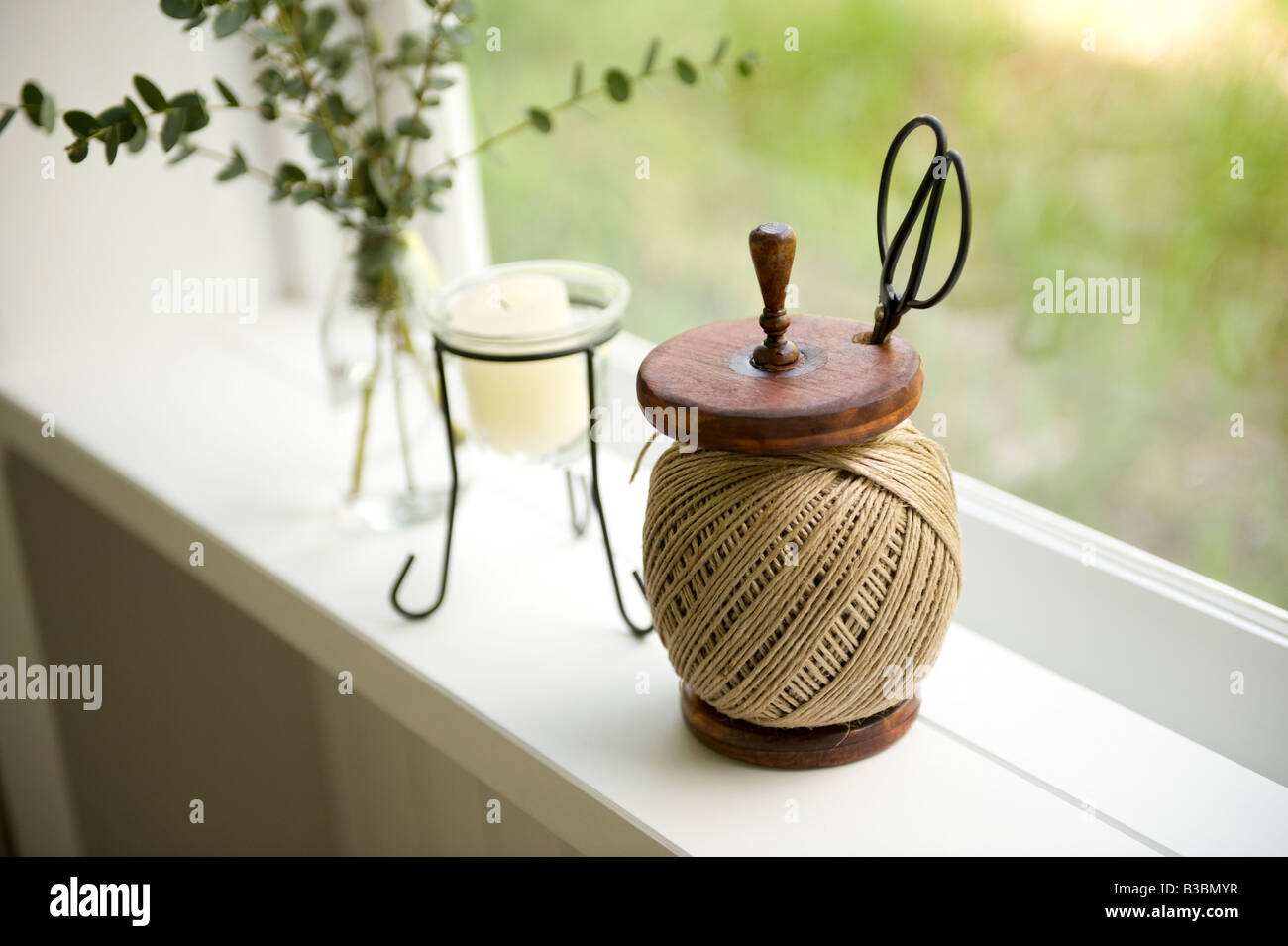 Hemp string by window Stock Photo - Alamy