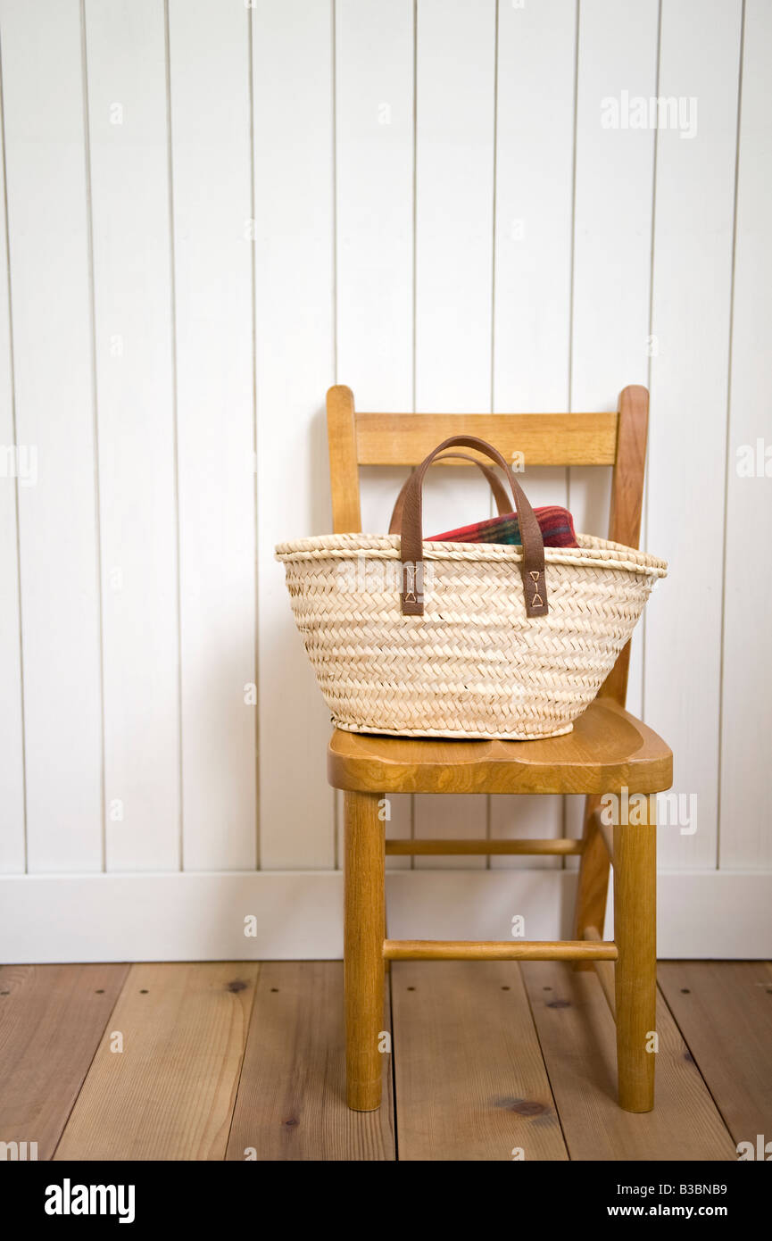 Basket on chair Stock Photo - Alamy