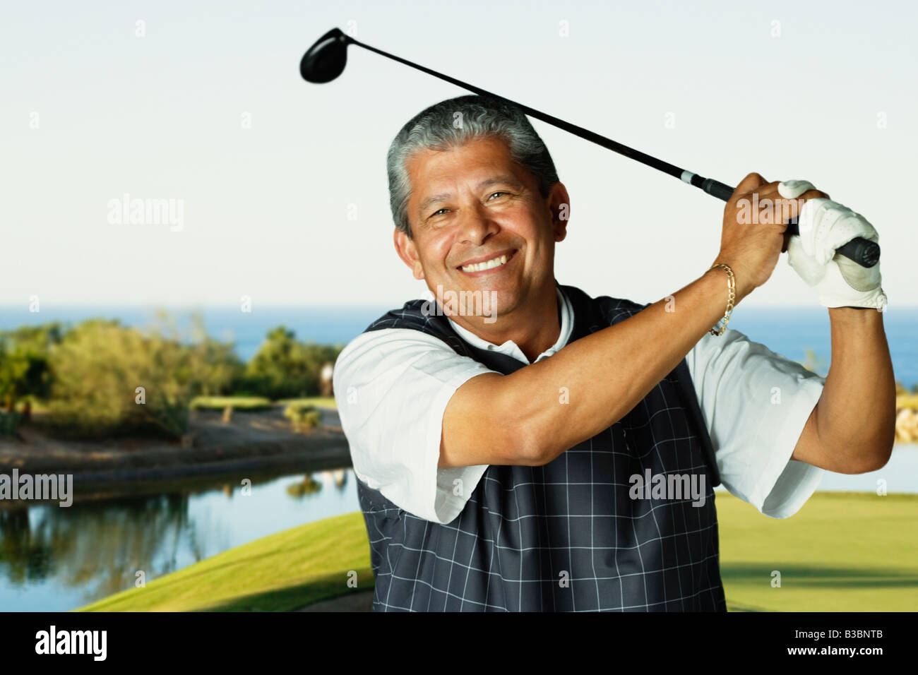 Mature man swinging golf club hi-res stock photography and images - Alamy
