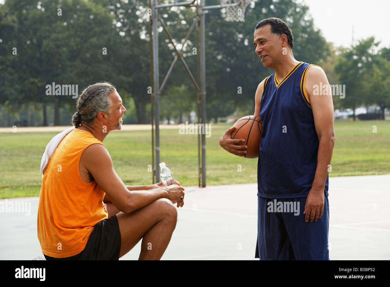 African men talking on basketball court Stock Photo - Alamy