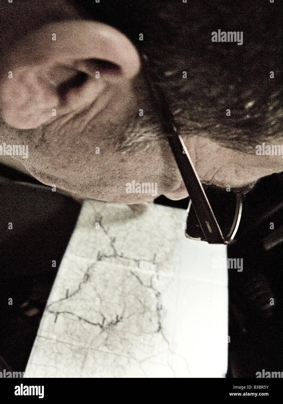 man looking to a map Stock Photo - Alamy