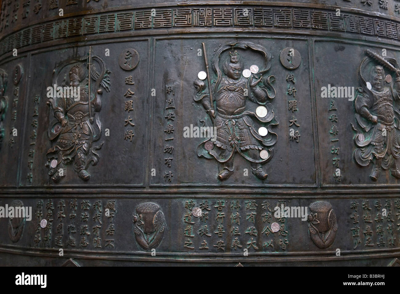 Coins placed on buddhist image Stock Photo - Alamy