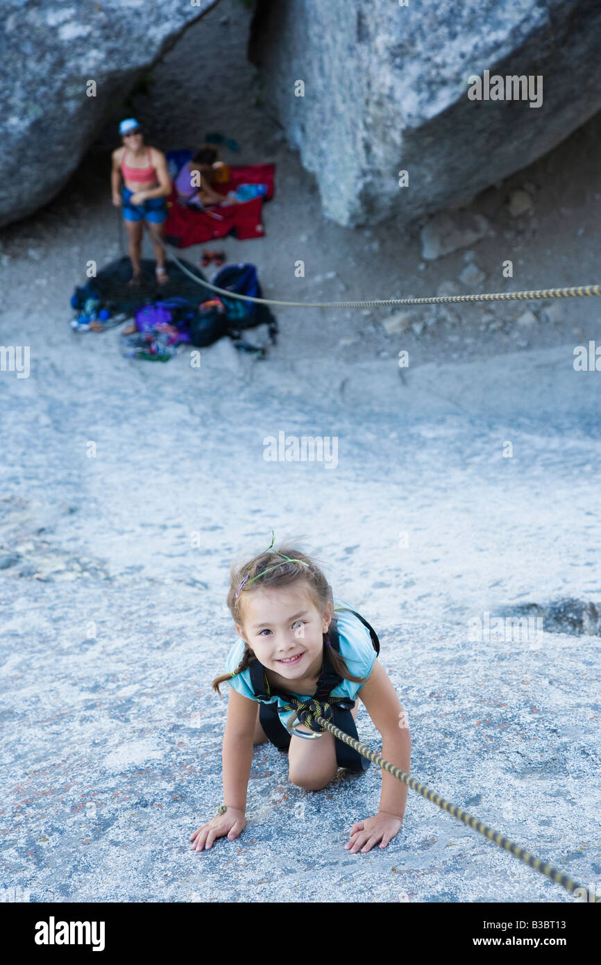 Asian girl rock climbing Stock Photo - Alamy