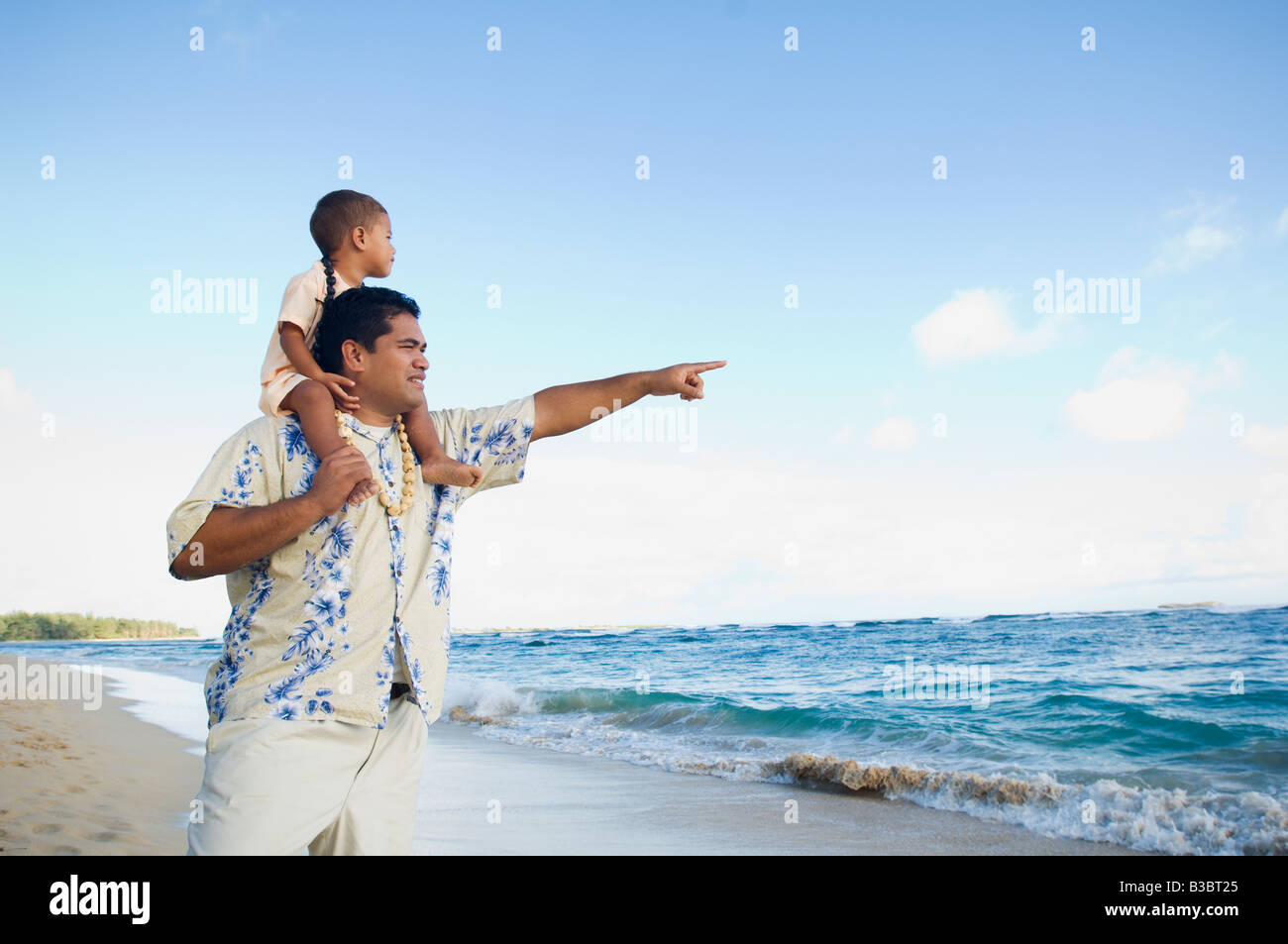 Pacific Islander father with son on shoulders at beach Stock Photo - Alamy
