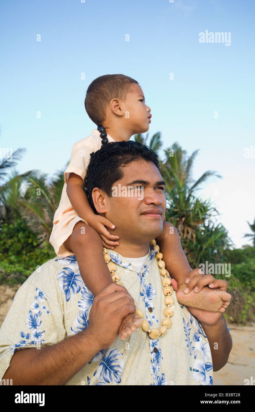 Pacific Islander father with son on shoulders at beach Stock Photo - Alamy