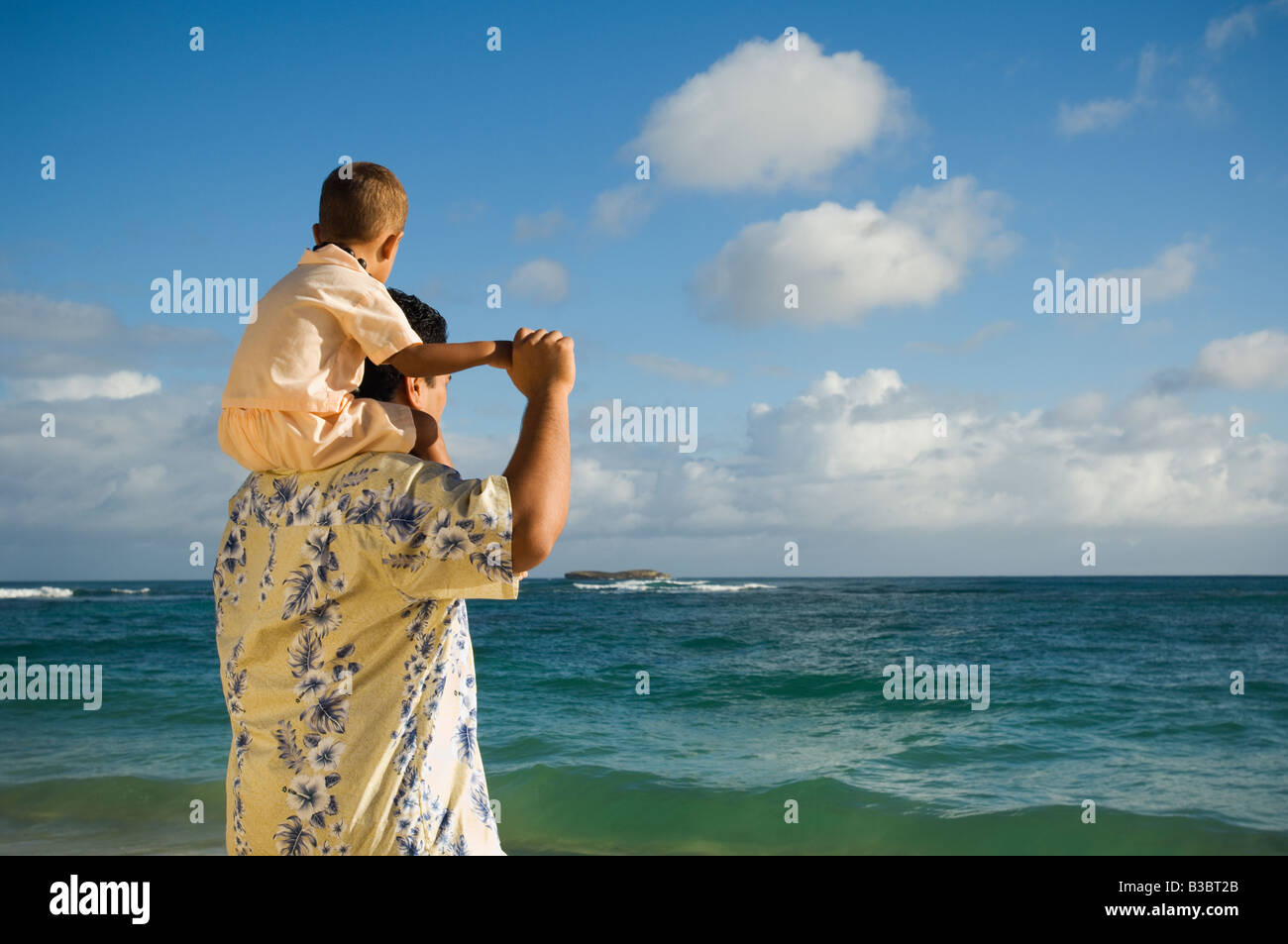 Pacific Islander father with son on shoulders at beach Stock Photo - Alamy