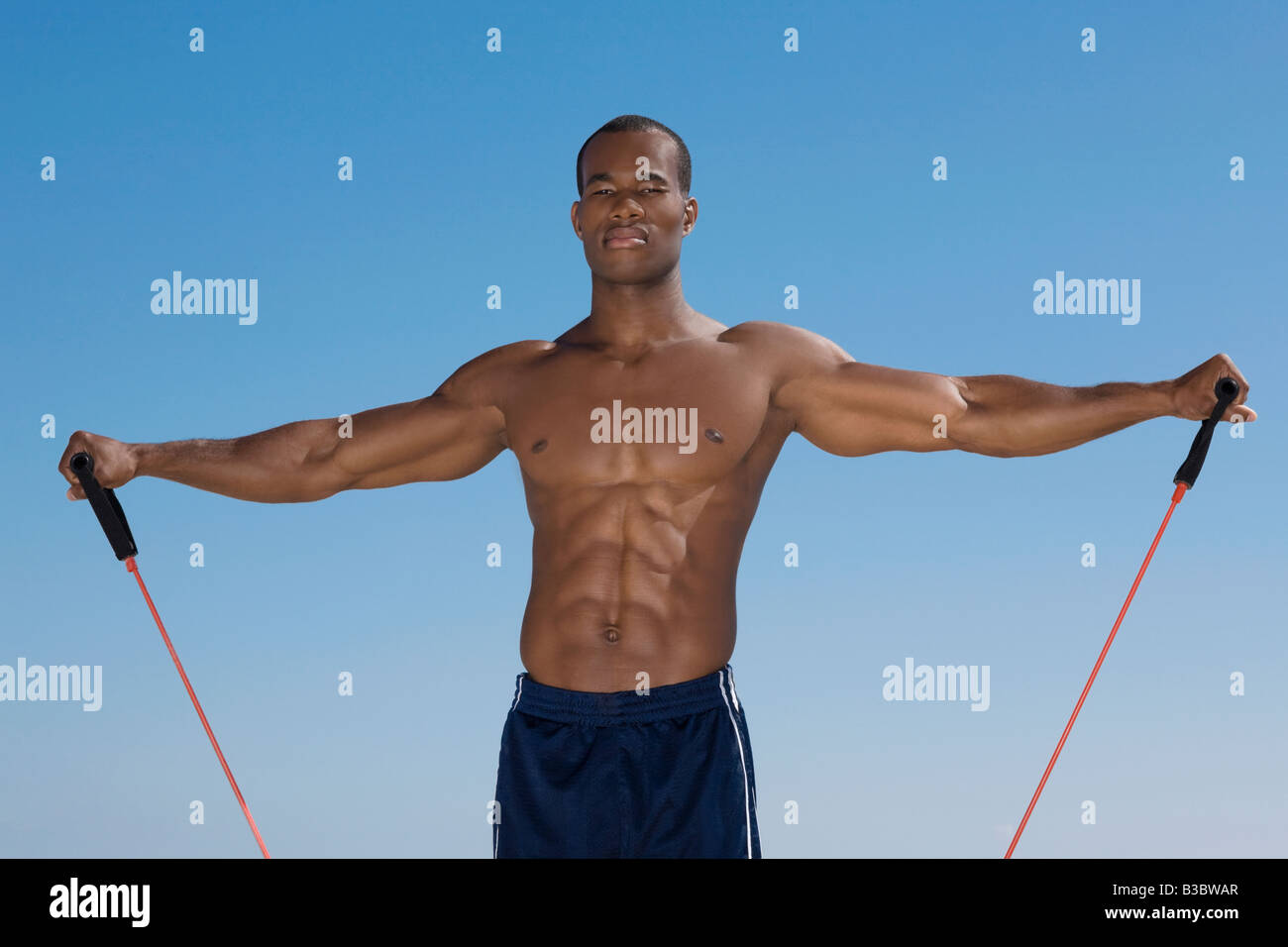 African man stretching with exercise band Stock Photo - Alamy