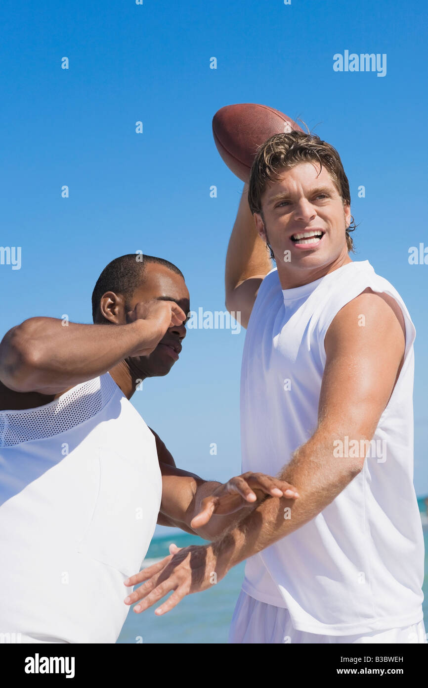 Two men playing football hi-res stock photography and images - Alamy