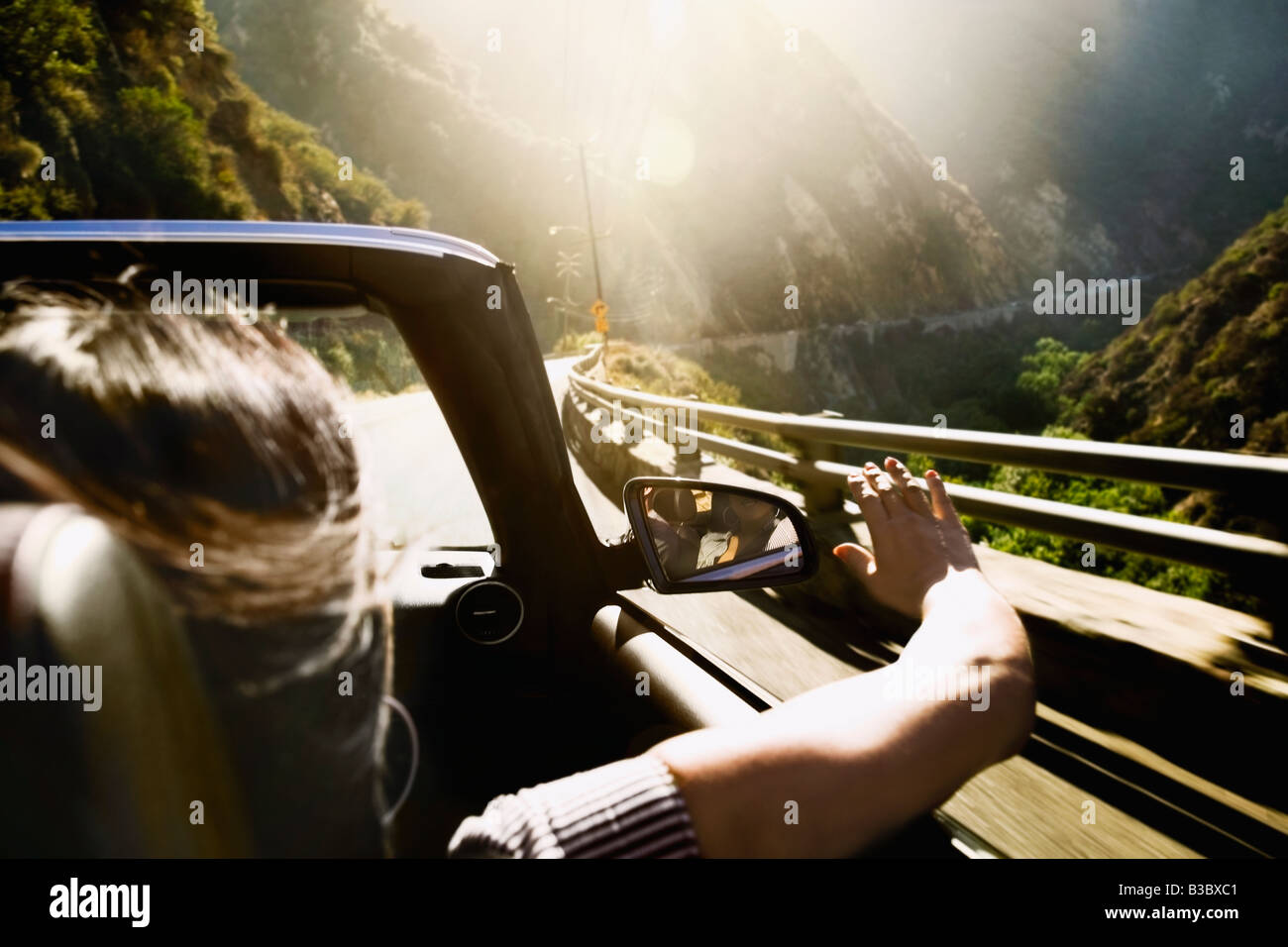 Asian woman in convertible car Stock Photo - Alamy
