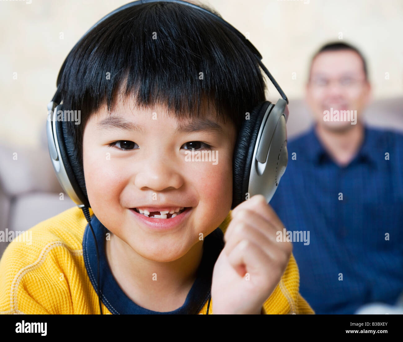 Asian boy with headphones hi-res stock photography and images - Alamy