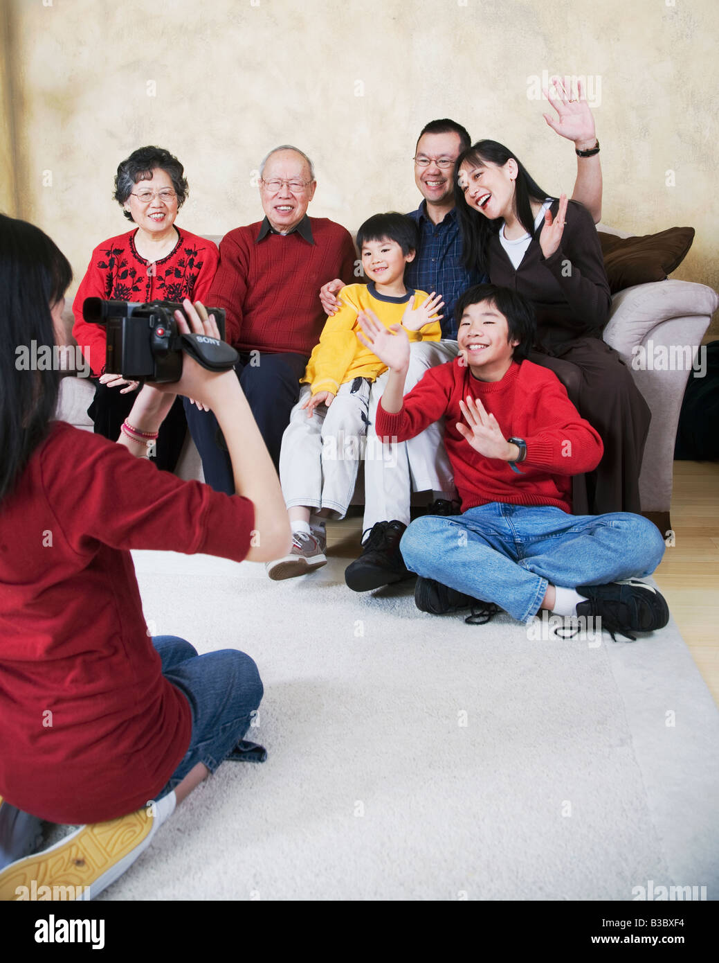 Multi-generational Asian family being video recorded Stock Photo - Alamy