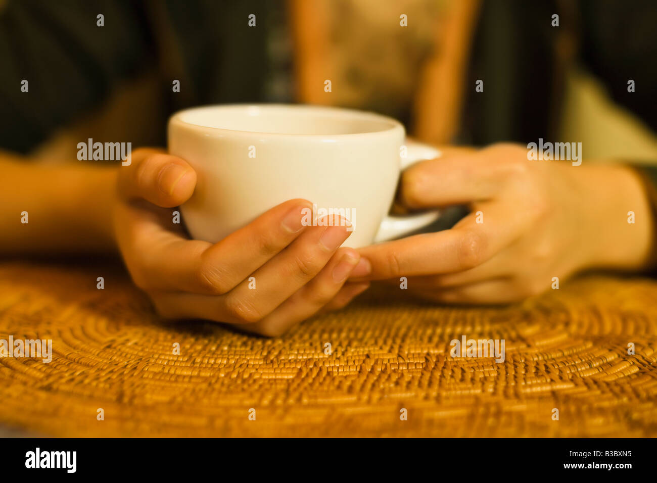 Close up of woman’s hands holding tea mug Stock Photo - Alamy