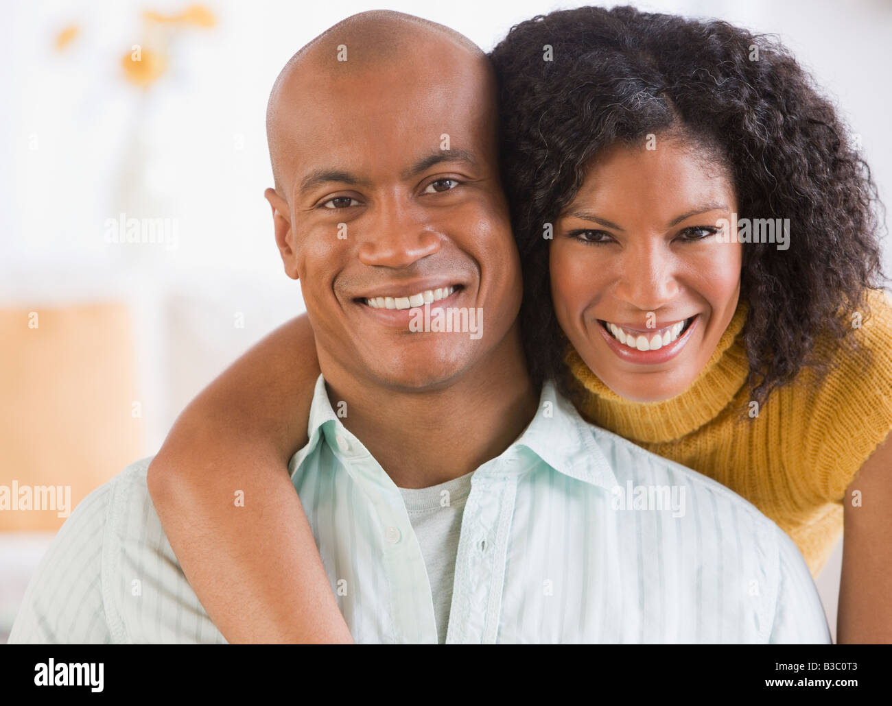African couple hugging Stock Photo - Alamy