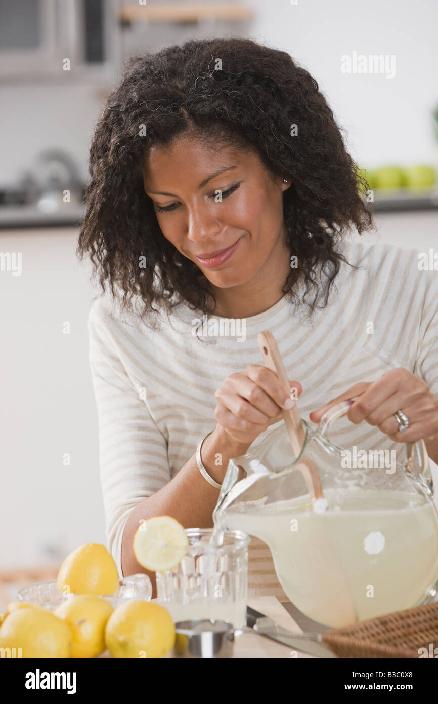 African woman pouring lemonade Stock Photo - Alamy