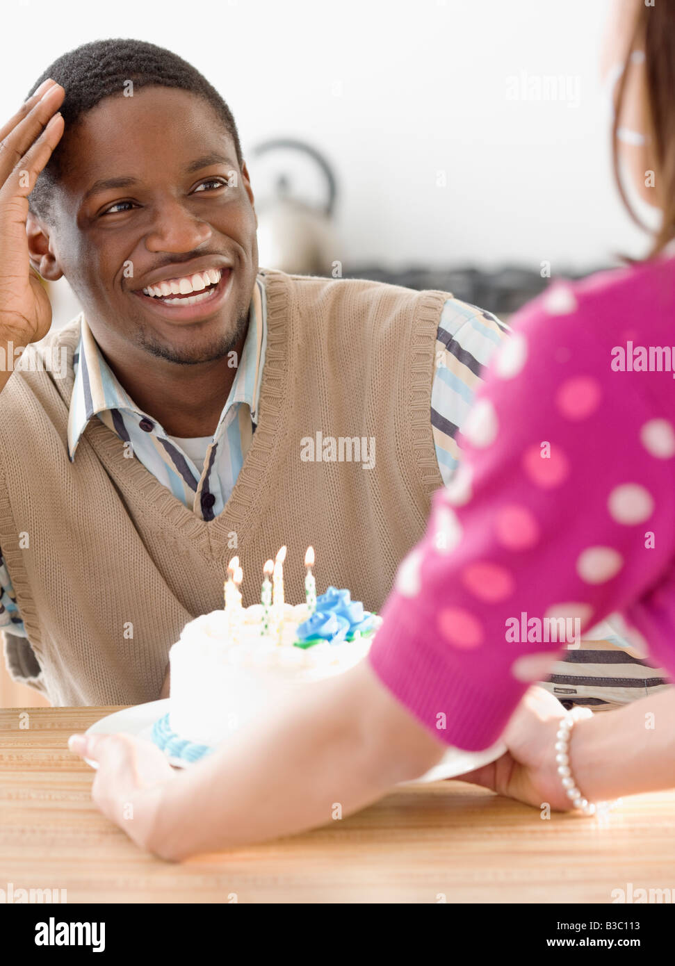 African man getting birthday cake Stock Photo - Alamy