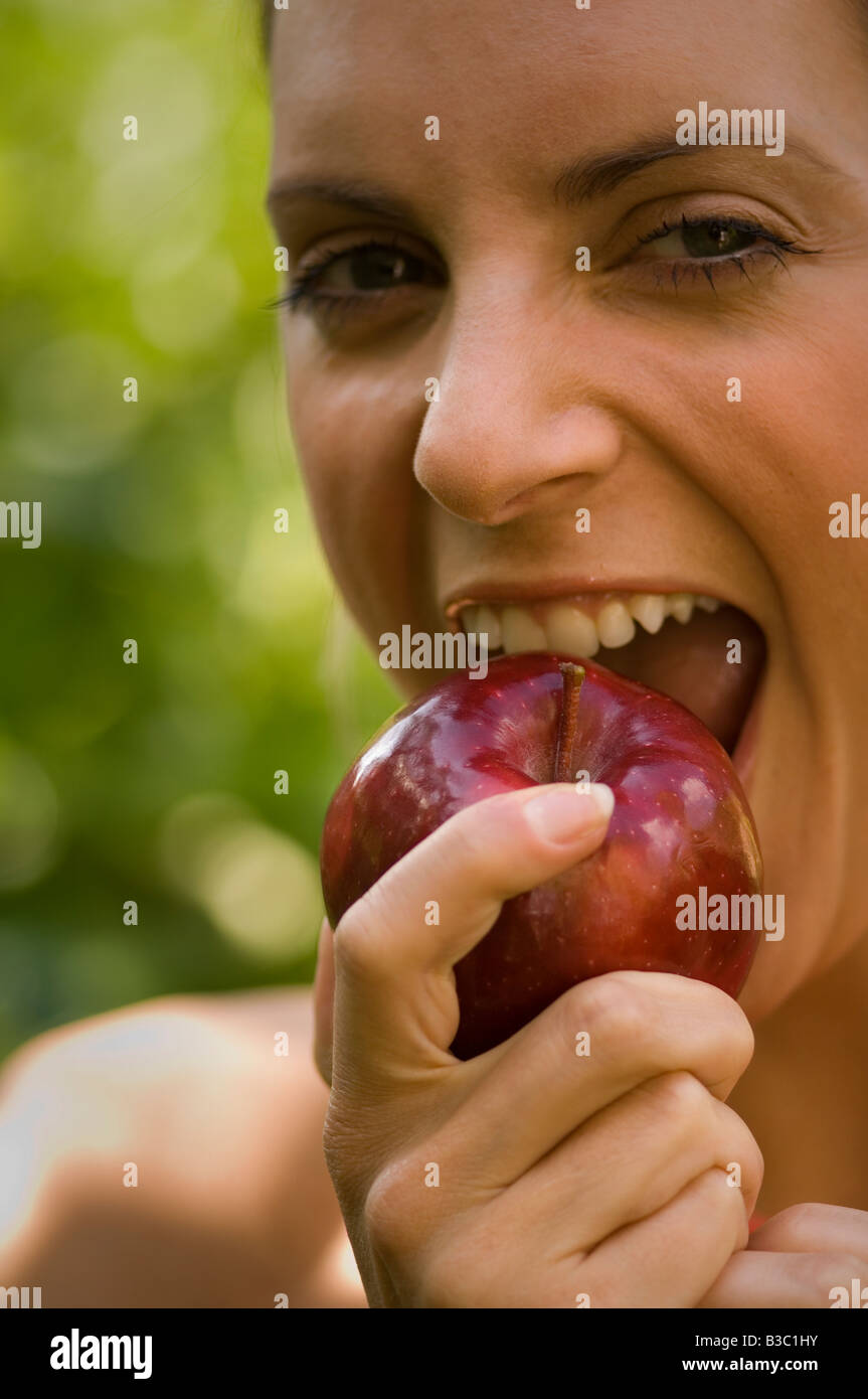 Biting fruit tree hi-res stock photography and images - Alamy