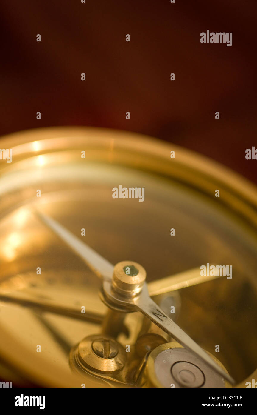 A brass compass close up Stock Photo - Alamy