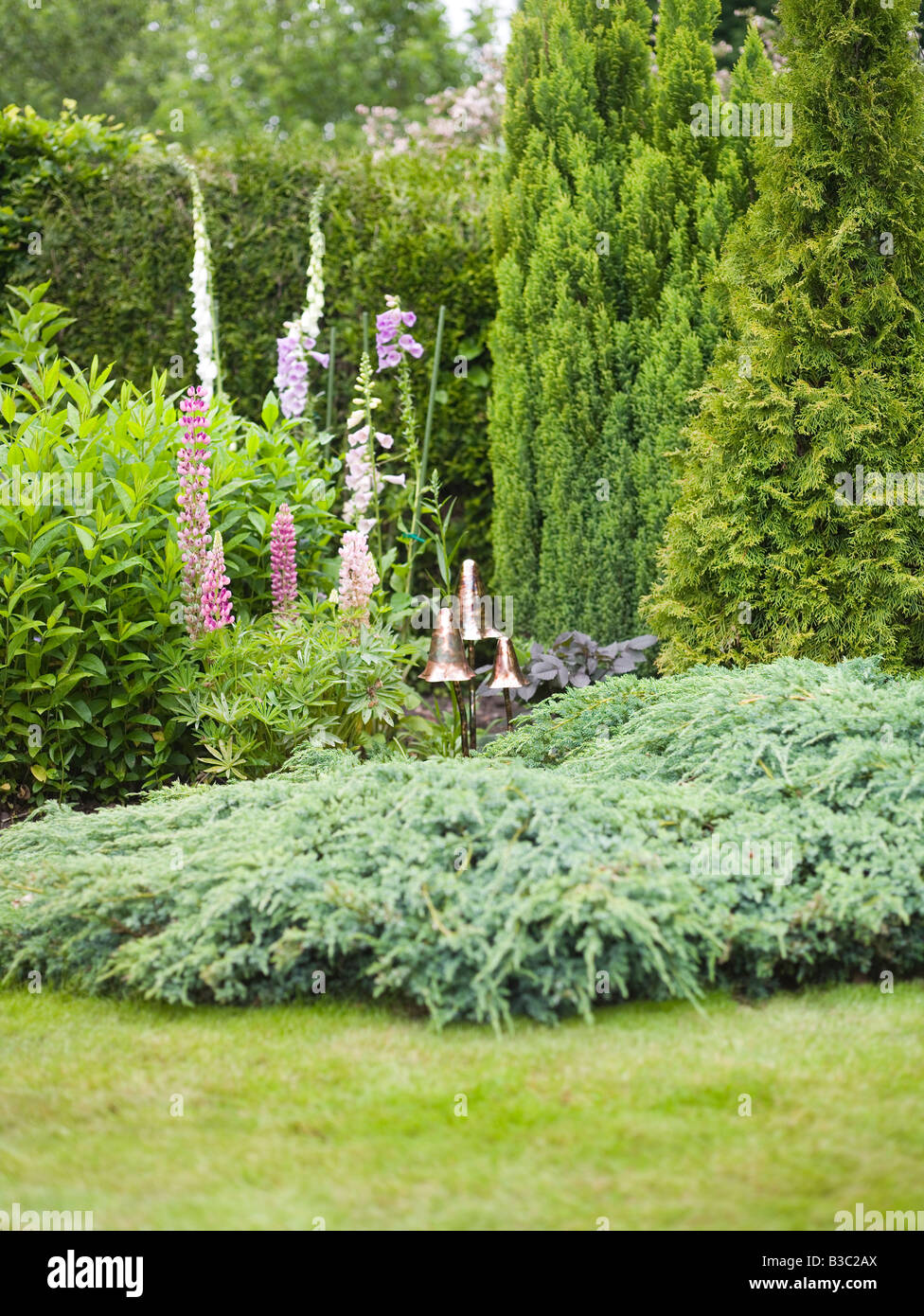 Toadstool statues in a garden Stock Photo - Alamy