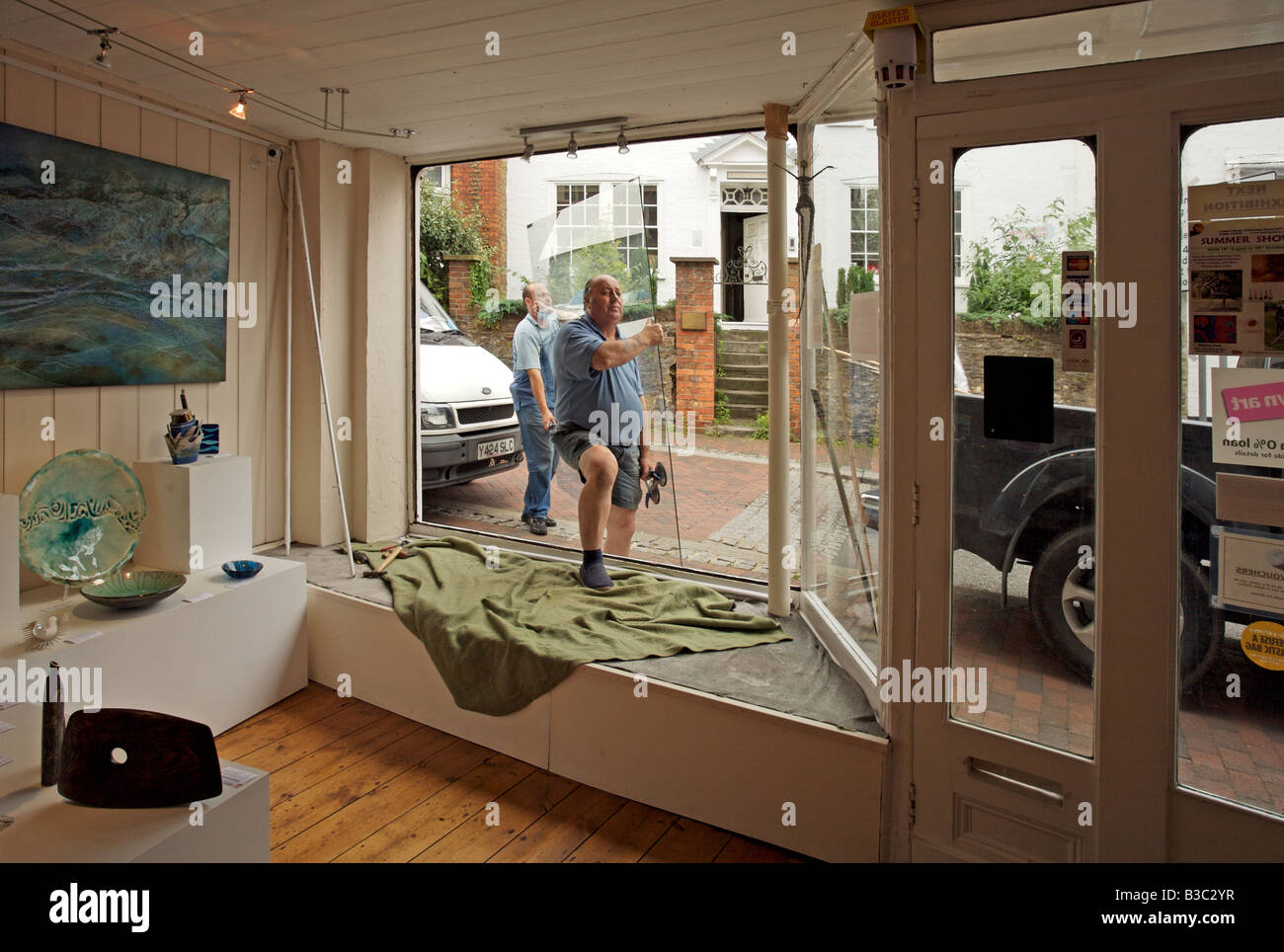 Shop window being repaired with new glass Stock Photo - Alamy