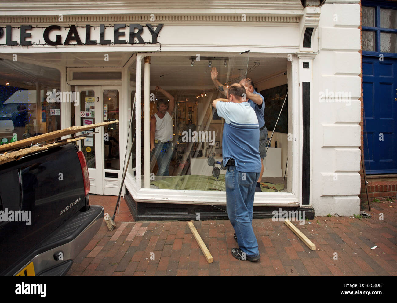 Shop window being repaired with new glass Stock Photo - Alamy