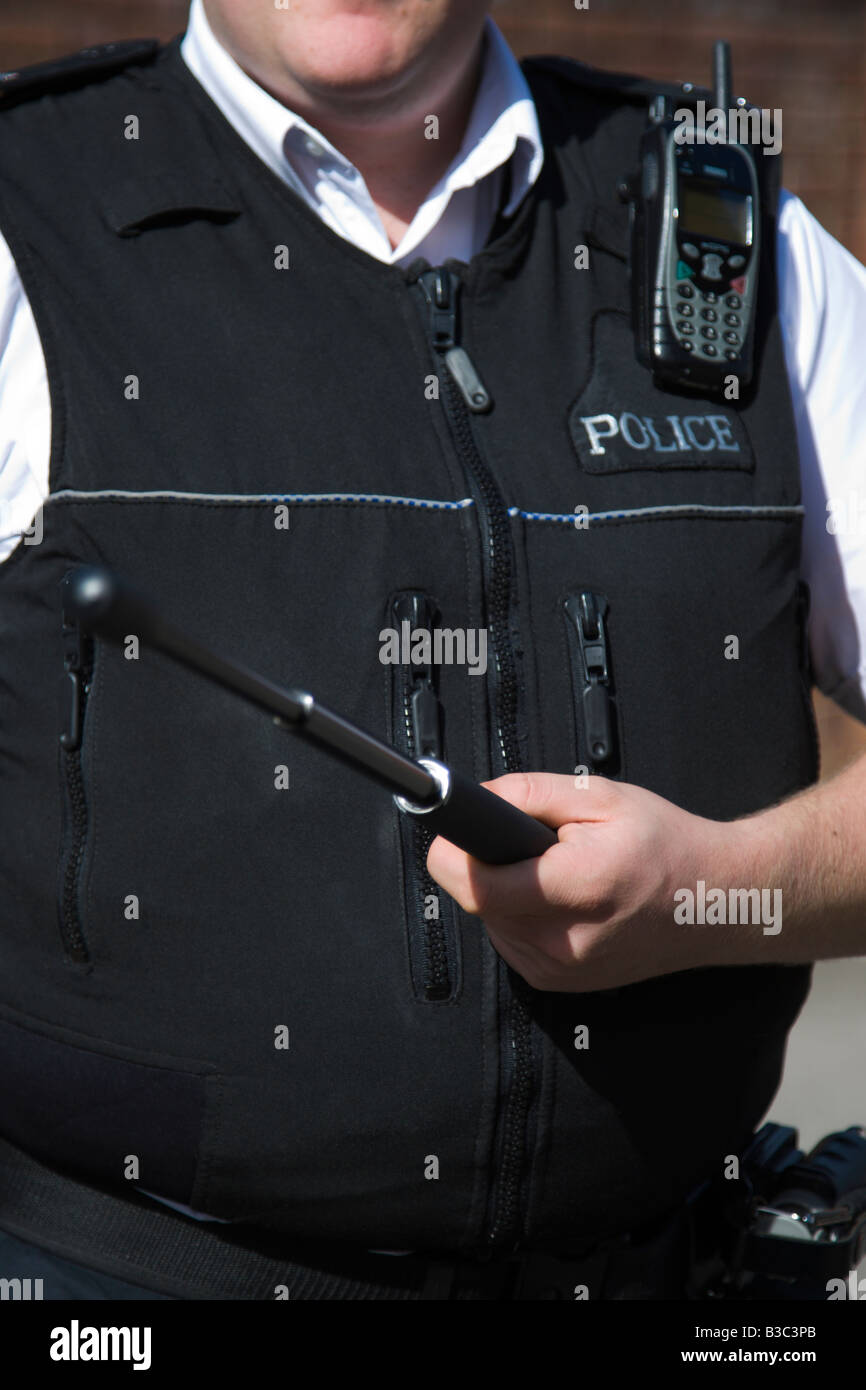 A Police Officer holds his autolock baton in a defensive position Stock ...