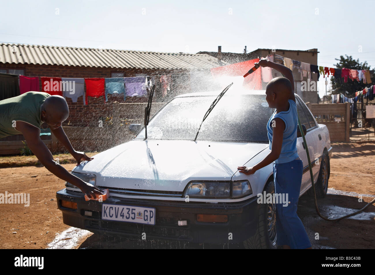 African boys washing car hi-res stock photography and images - Alamy