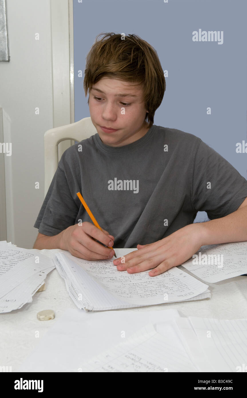 Young boy doing his homework Stock Photo - Alamy