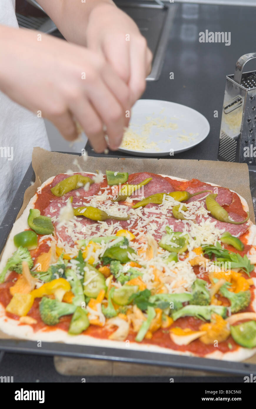 A boy baking pizza Stock Photo - Alamy