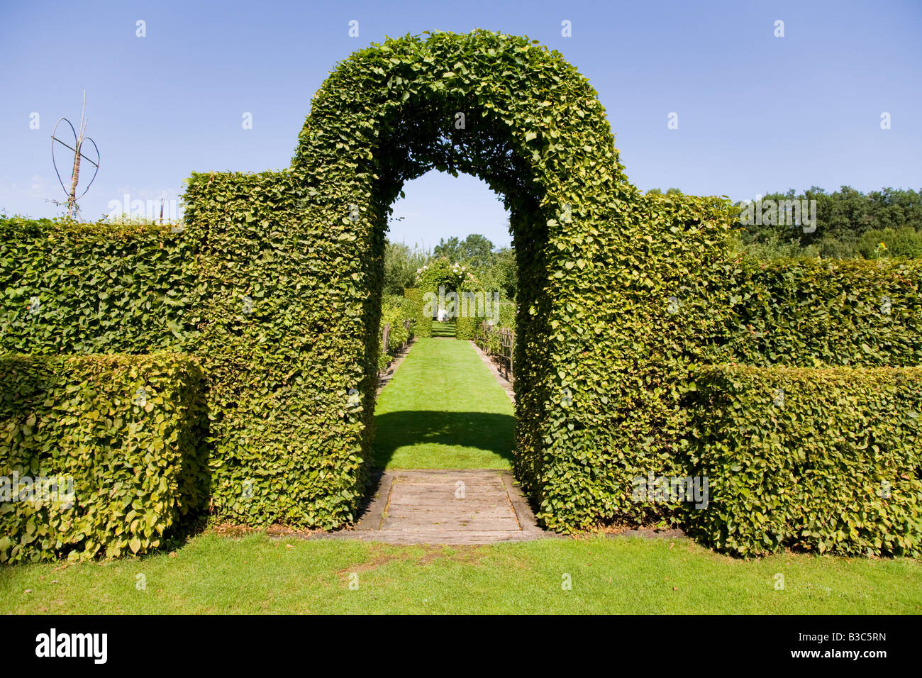 Topiary passageway through the gardens of Le Prieuré Notre Dame d'Orsan ...
