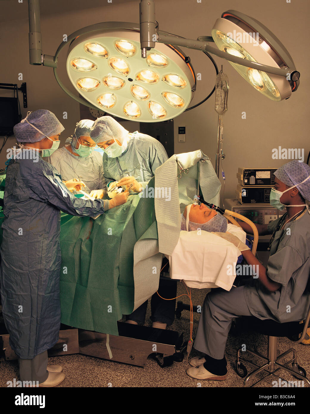 Hospital surgeons performing surgical operation Stock Photo - Alamy