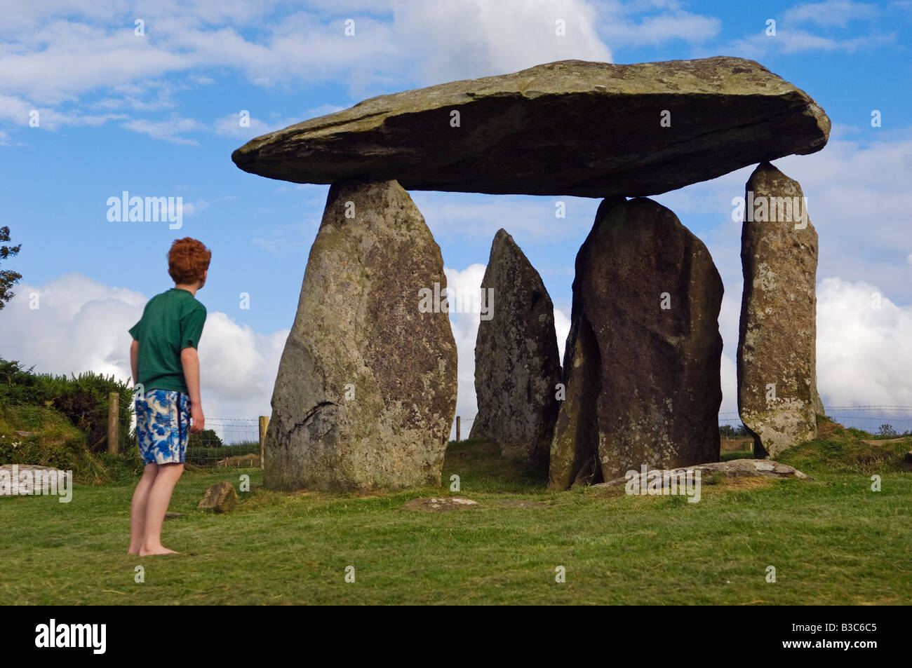 UK, Wales, Pembrokeshire. A young boy visits the site of the ancient ...