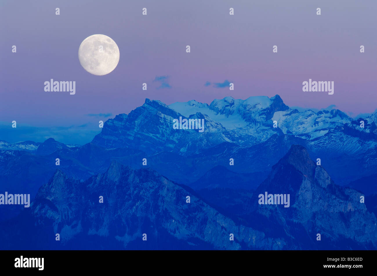 Swiss Alps and full moon, Schwyz, Switzerland Stock Photo - Alamy