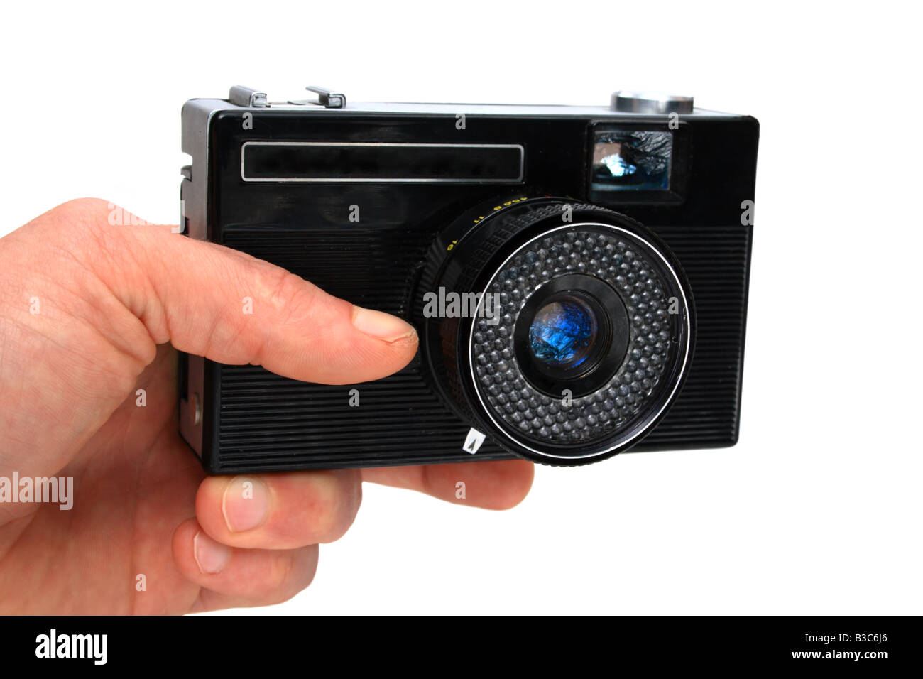 aged camera in an hand isolated on white Stock Photo - Alamy