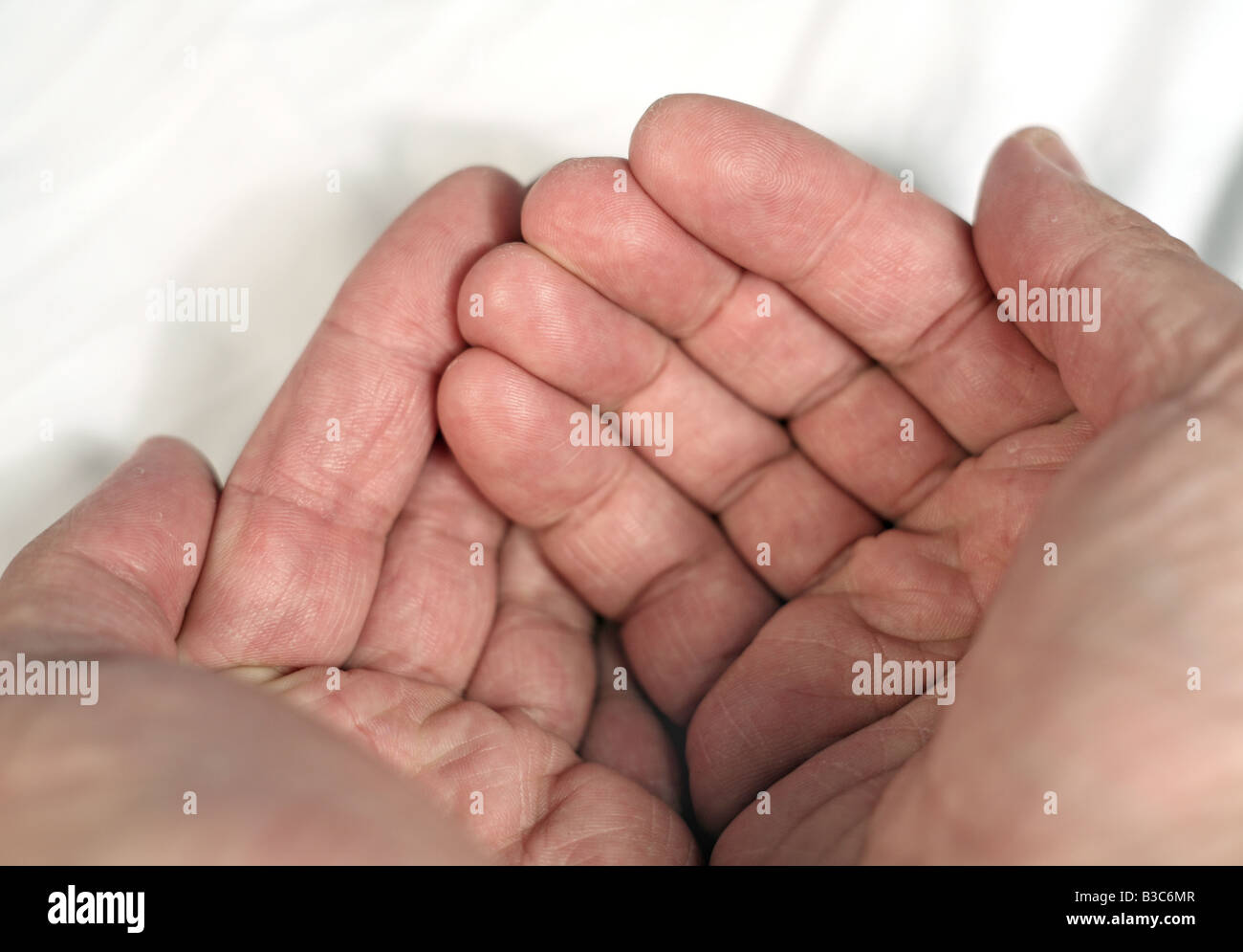 Hand folds hi-res stock photography and images - Alamy