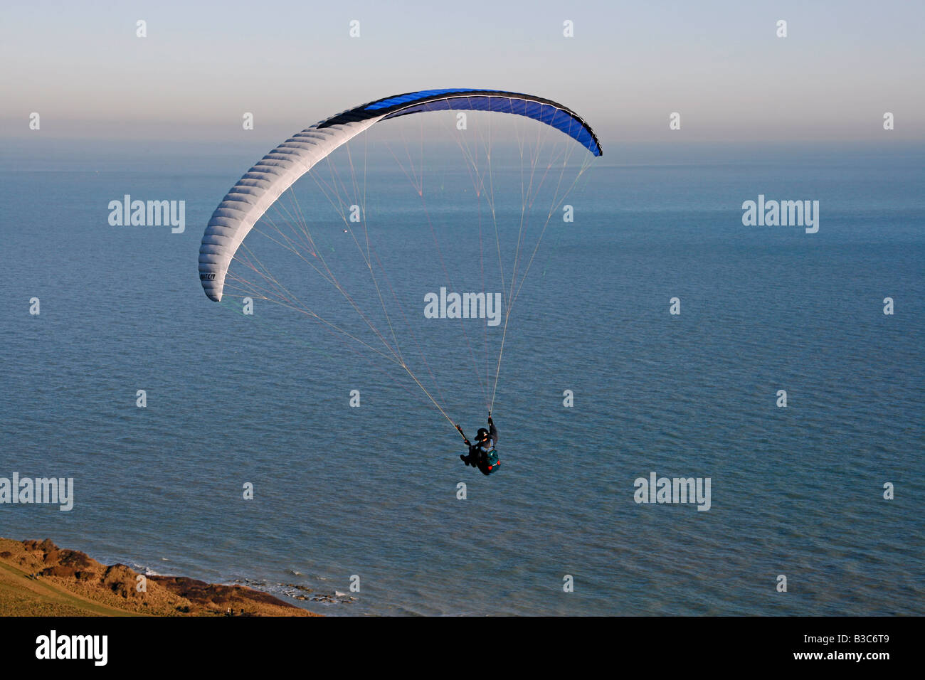 England, East Sussex, Eastbourne. Paragliding is a recreational and ...