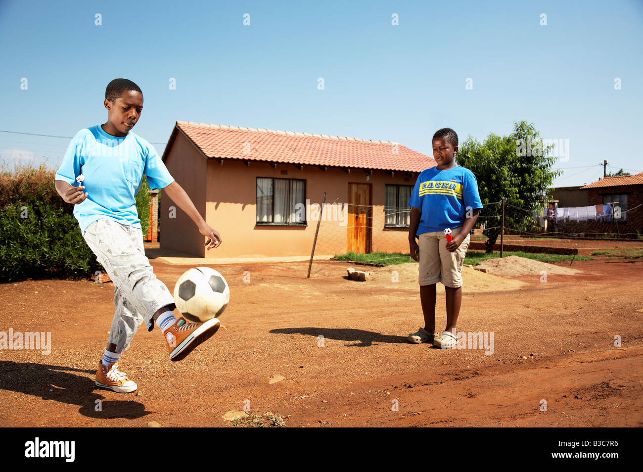 african boys playing soccer Stock Photo - Alamy