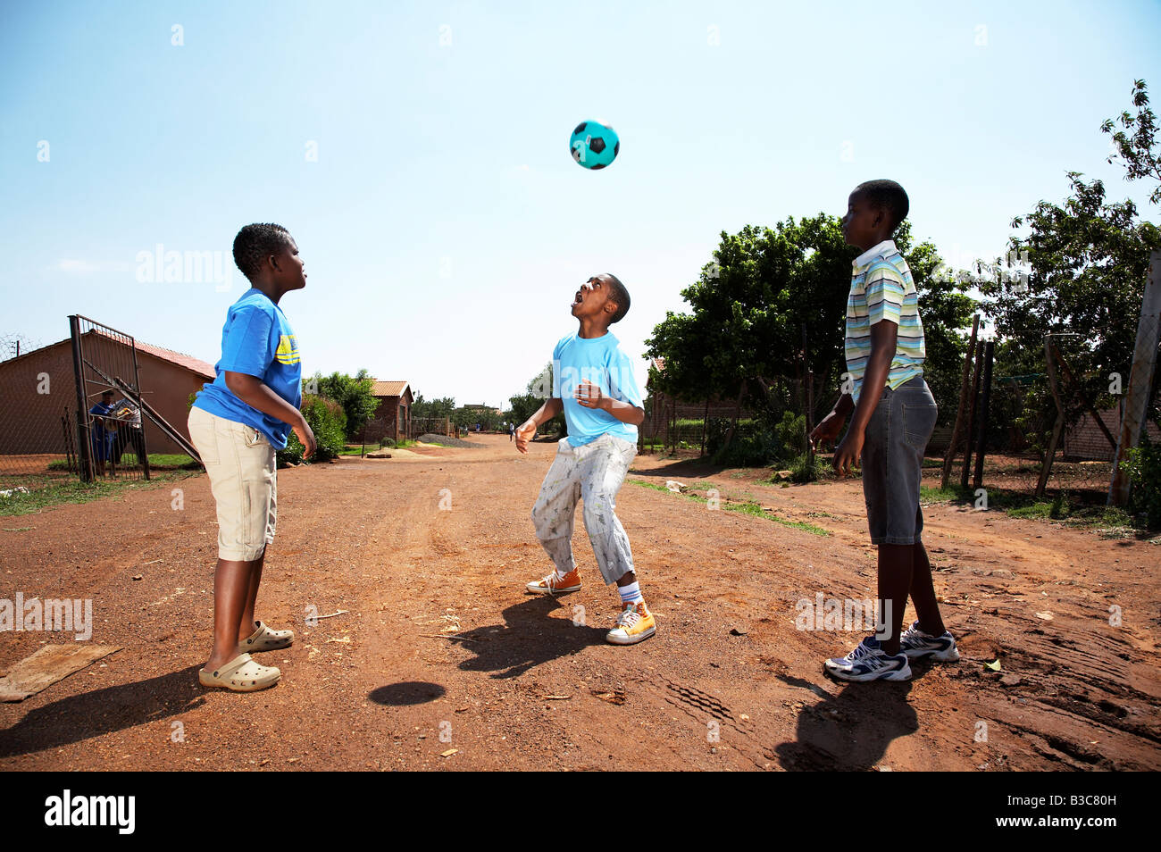 african boys playing soccer Stock Photo - Alamy