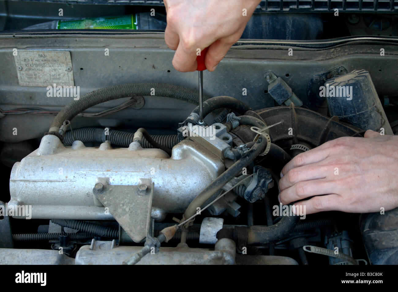 mechanic working on an engine Stock Photo - Alamy