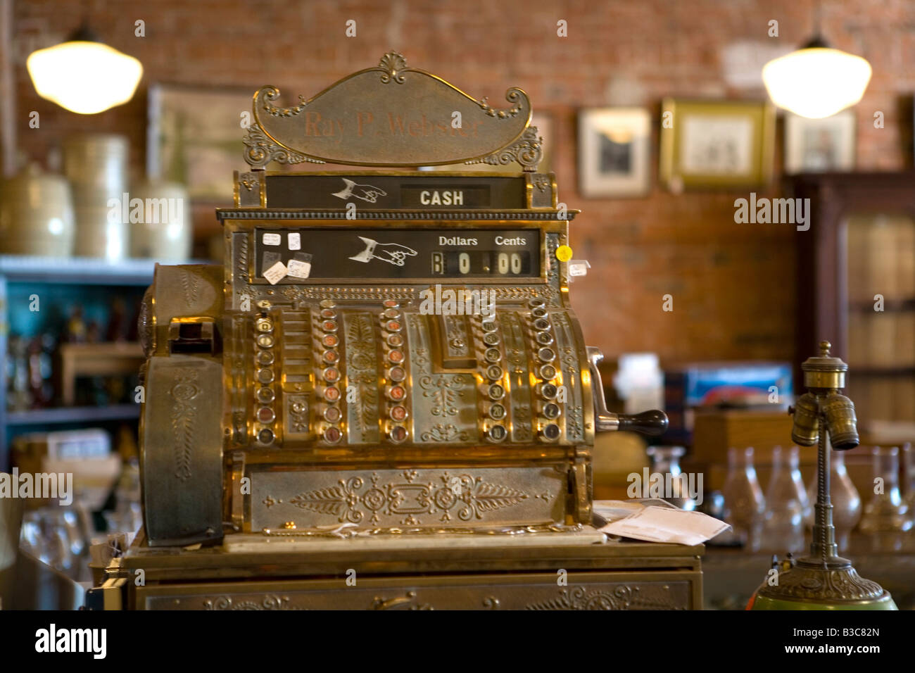 An antique brass cash register in country store Stock Photo - Alamy