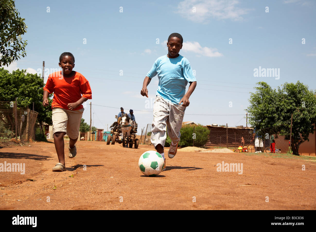 african boys playing soccer Stock Photo - Alamy
