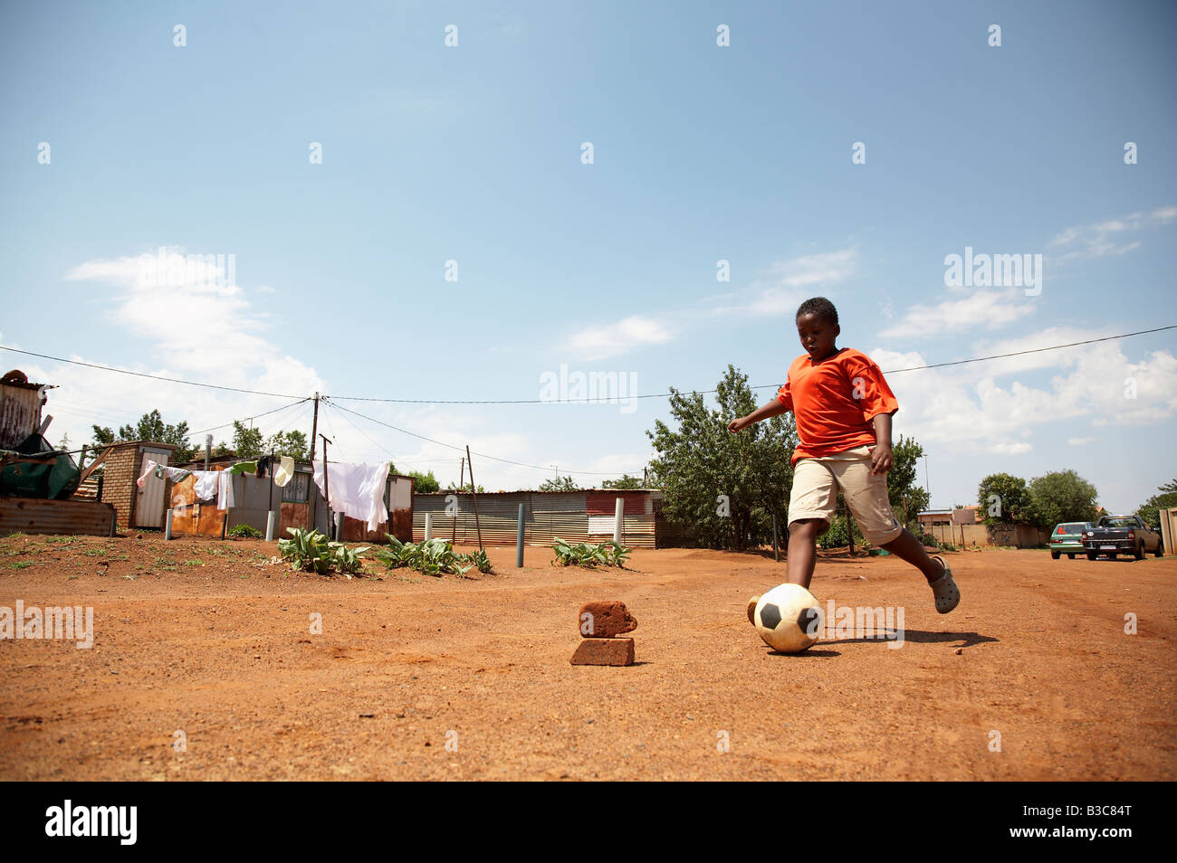 African Boys Playing Football High Resolution Stock Photography and ...