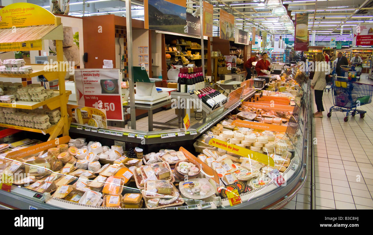 Cheese counter of a Calais supermarket Stock Photo - Alamy