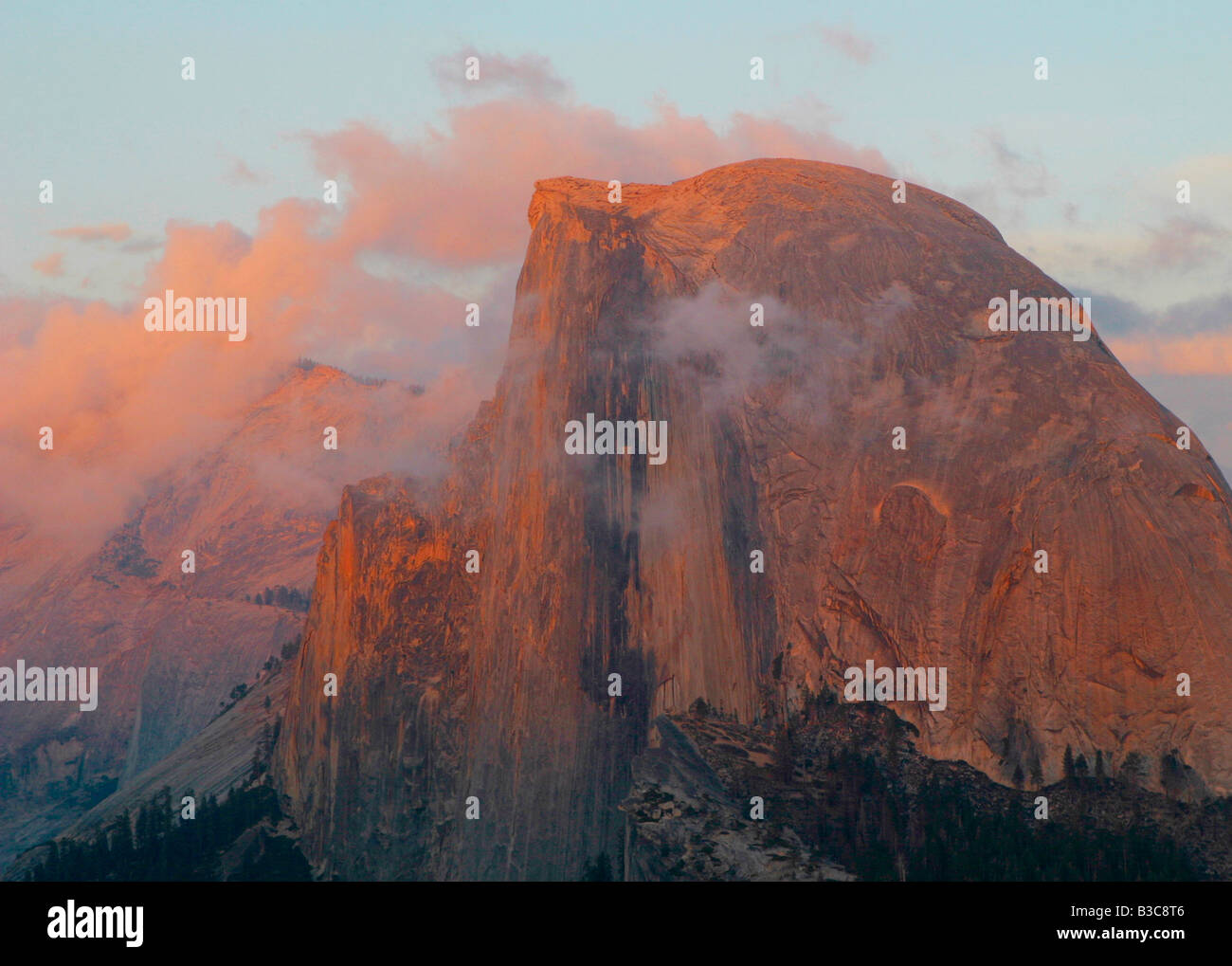 Half Dome, Yosemite, with orange clouds at sunset Stock Photo - Alamy