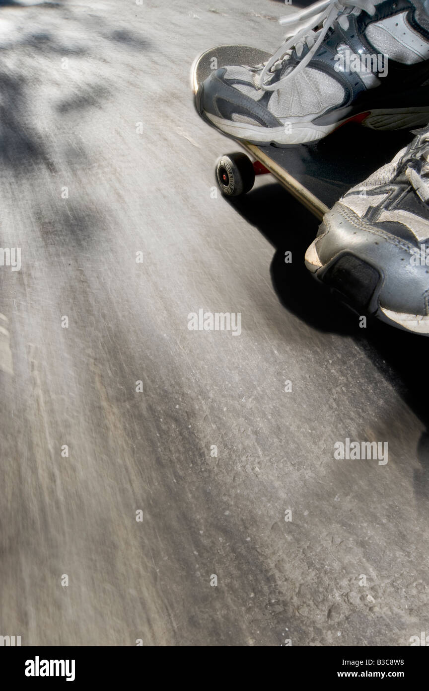 Skateboarder Teenager Riding Skateboard In Fast Motion Blur Detail ...
