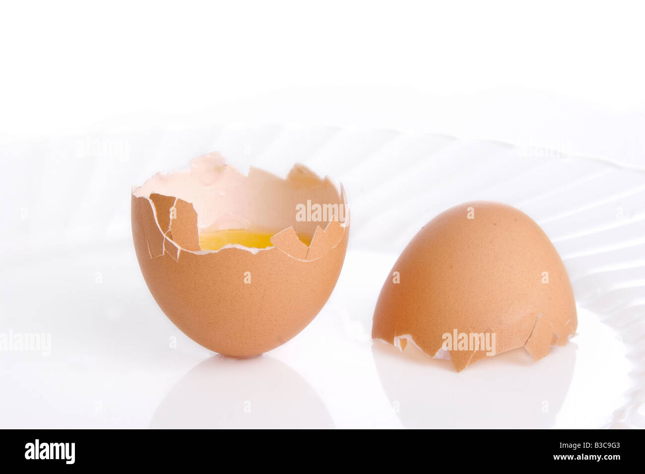 Two cracked eggs hi-res stock photography and images - Alamy