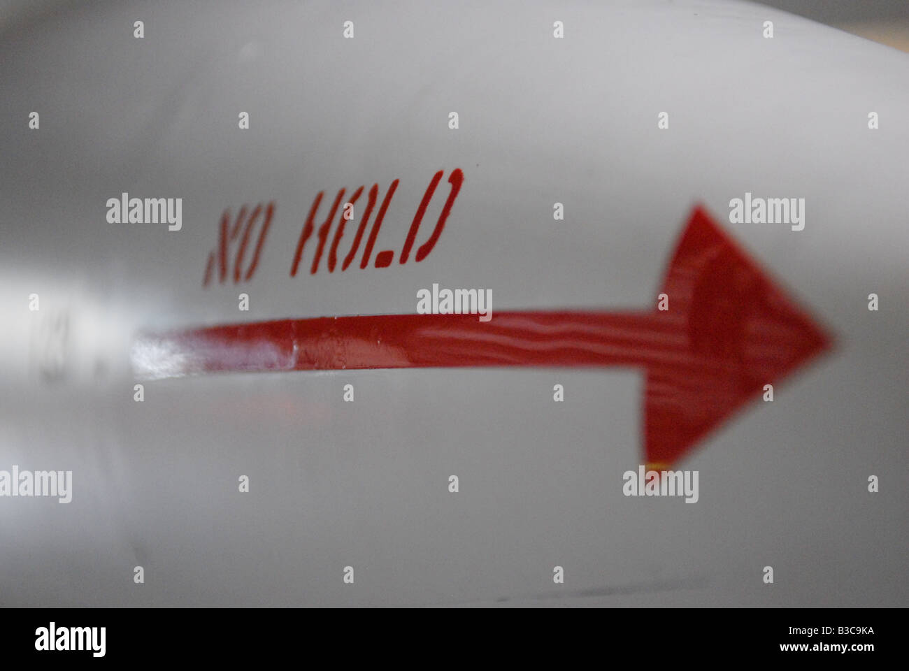 Aircraft signage with red arrow Stock Photo - Alamy