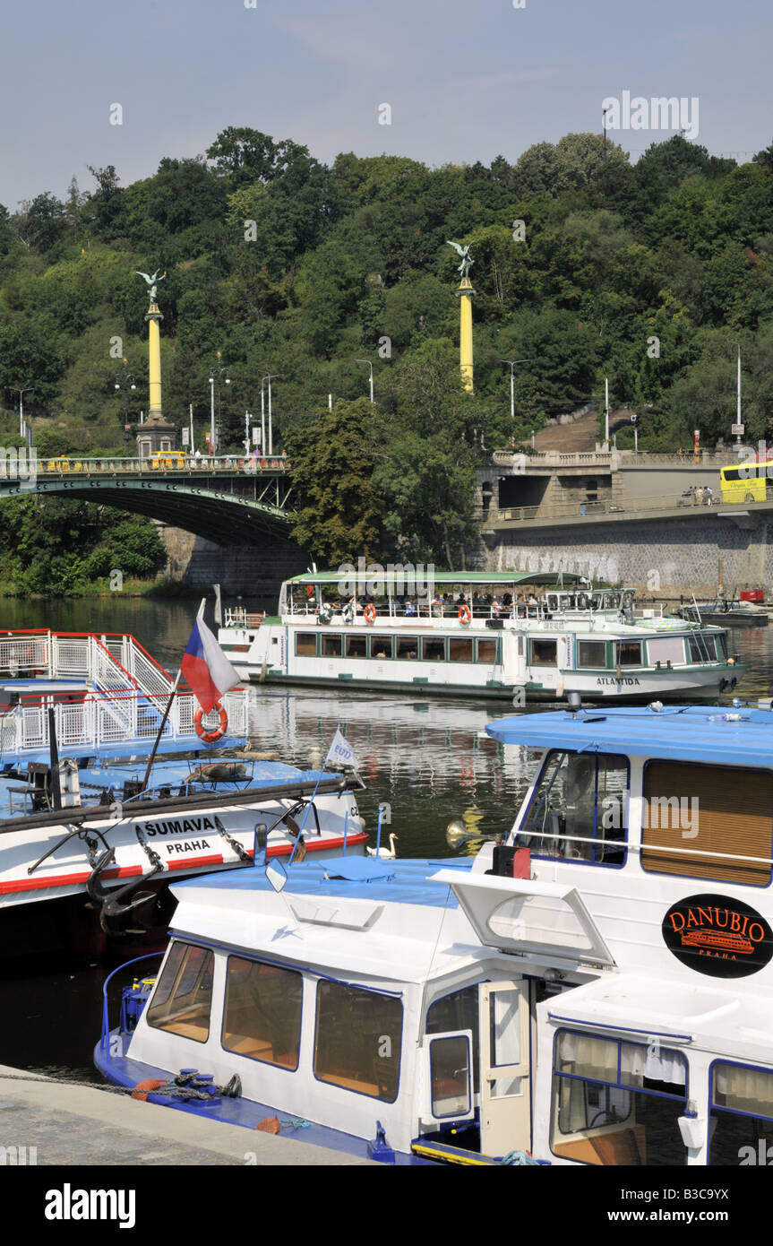 Pleasure cruise boat on River Vltava passing Cechuv Bridge in Prague ...