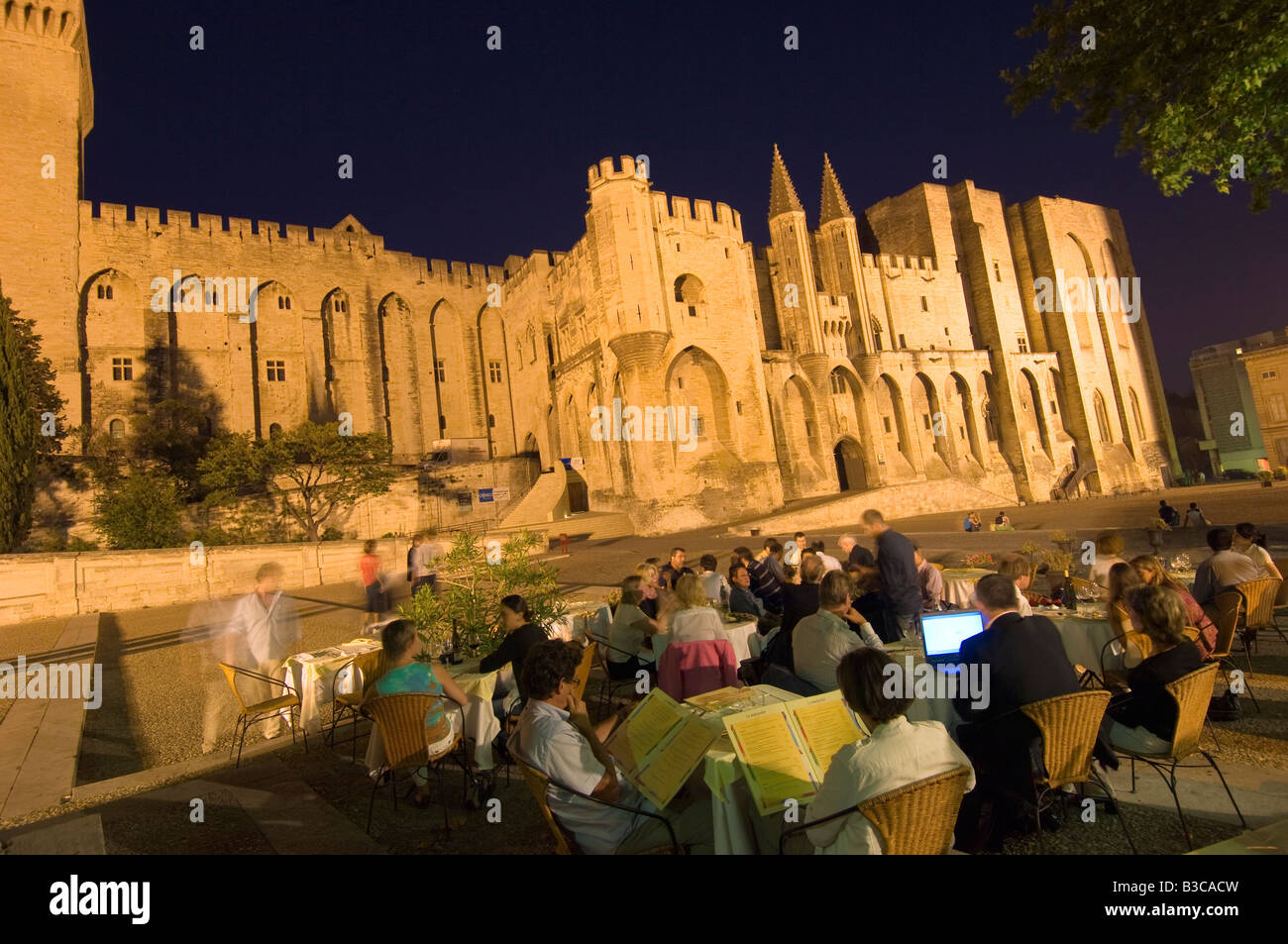 Europe France Provence Avignon dining alfresco at night by Palais des ...